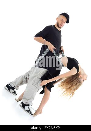 Rapper and graceful girl hold metal chain isolated on white background ...