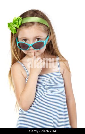 Little girl in striped sundress and green band in hair with several ...