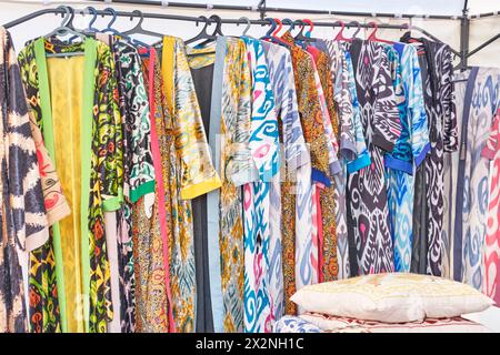 Women's Central Asian robes with traditional patterns and colorful ...