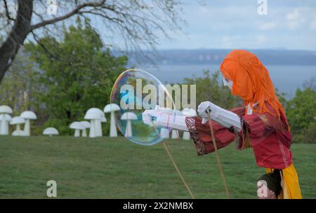 giant puppet making huge soap bubbles Stock Photo - Alamy