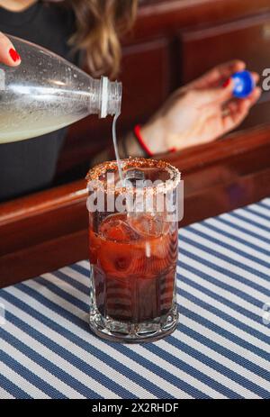 Preparing to taste a delicious bloody mary, to cool off in this hot ...