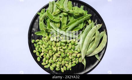 Peels of Indian green Flat beans vegetable known as Valor Papdi, whole ...