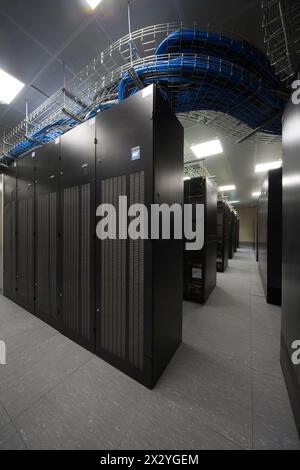 Telecommunication racks in the server room with lots of cables Stock ...