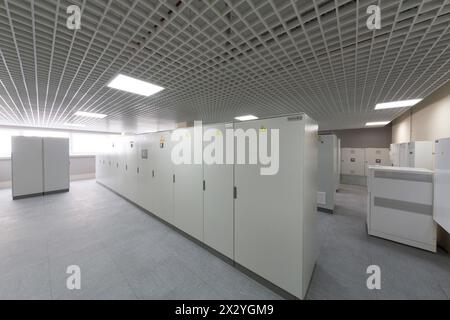 Room with rows of racks with equipment for telecom Stock Photo - Alamy