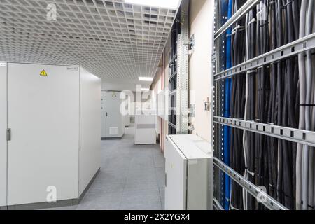 Rows of racks with equipment for telecom and cables Stock Photo - Alamy