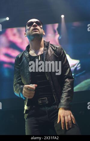 Lead singer of music group performs on stage with spotlights Stock ...