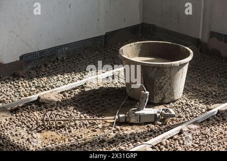 Expanded clay aggregate with bucket on the floor in construction room ...