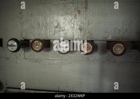 Worn stoplists with porcelain labels, including Principal 8, on a ...