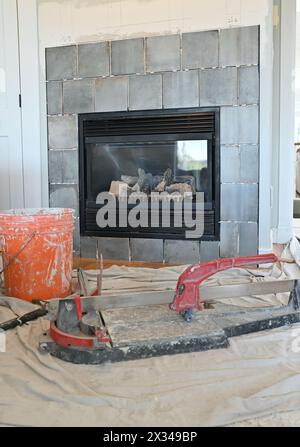 Home renovation project in progress, weekend tiling to update fireplace ...