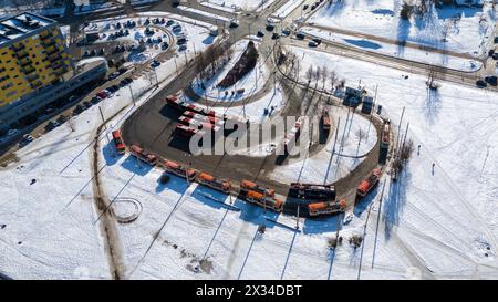 Drone photography of small terminal bus station with many parked buses ...
