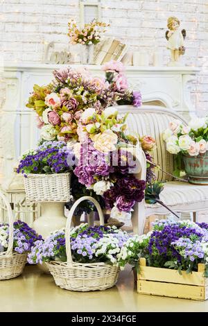 Flower pots decorate old wooden door, Spain Stock Photo - Alamy