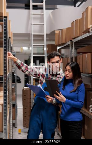 Post office storage workers managing parcels delivery, carrying and ...