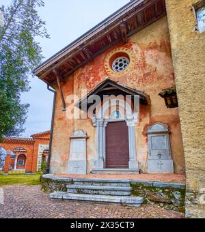 The old shabby wall of medieval San Maurizio Church in Lugano ...