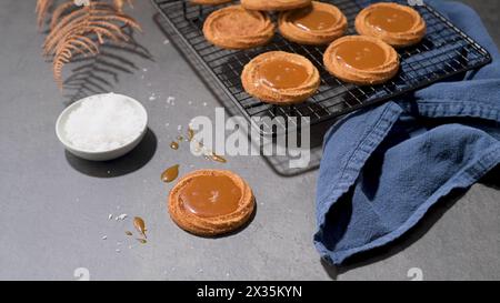 Caramel cookies flowing out of the oven, in the kitchen after baking ...