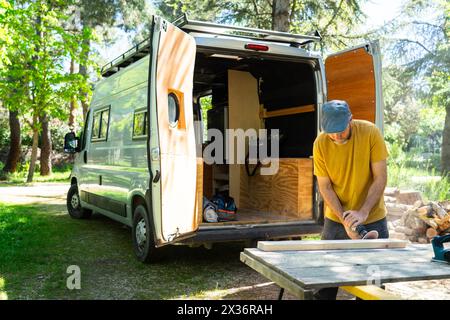 Man working camperizing a camper van Stock Photo - Alamy
