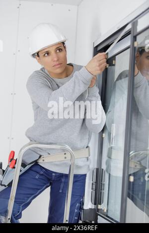 window setter installing the window Stock Photo - Alamy