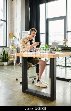 A handsome businessman with a prosthetic leg working diligently at his ...