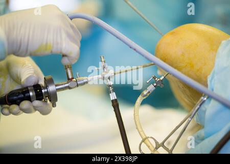 Doctor is doing puncture in knee at the center of endosurgery and ...