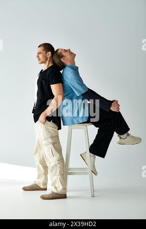 Two men peacefully sitting together Stock Photo - Alamy