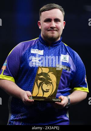 Luke Littler with the trophy after winning night two of the 2025 BetMGM ...