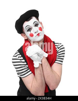 Funny mime artist in beret pointing at something on white background ...