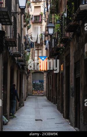A flag of the Estelada of the Catalan Nationalists in an alley of the ...