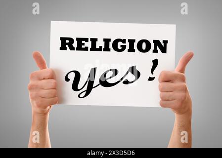 Hands of a religious man with okay sign holding a white sign with drawn ...