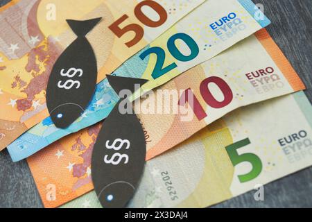 fish shapes with paragraphs and money, symbol for fishing quota Stock ...