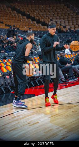 Miami Heat's Tyler Herro, center left, puts up the shot as Philadelphia ...
