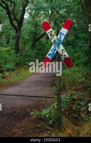 A railway crossing in the forest, St. Andrew's Cross in the forest ...
