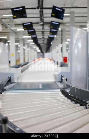 Big empty modern workshop with conveyor for sorting boxes, many ...