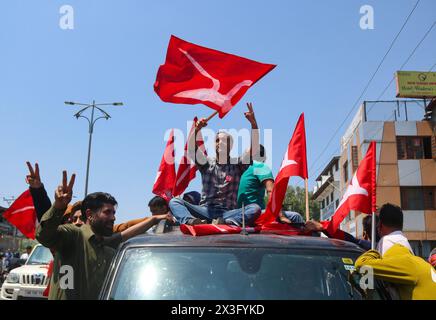 National Conference candidate Aga Syed Mahmood flashes a victory sign ...