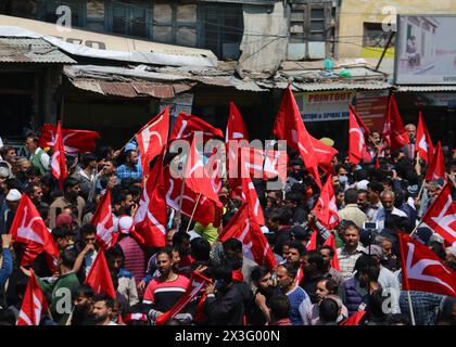 National Conference candidate Aga Syed Mahmood flashes a victory sign ...