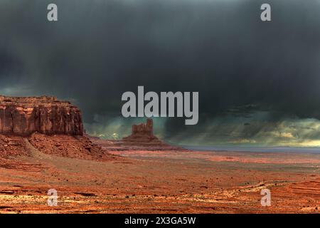 Monument Valley during a dark, eerie store creting an ominous look and ...