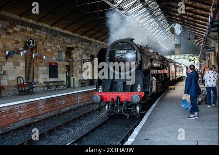 92134 steam train pulling into Pickering Station with passengers on the ...