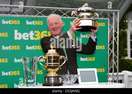 Trainer Willie Mullins with the Champion Jump trainer trophy at Sandown ...