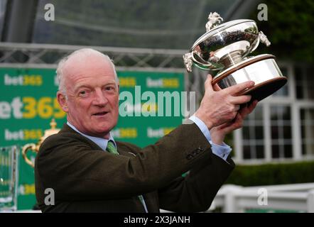Trainer Willie Mullins with the Champion Jump trainer trophy at Sandown ...
