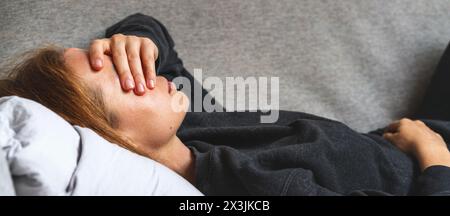 woman cover face felling sad from health problems. psychiatrist is ...