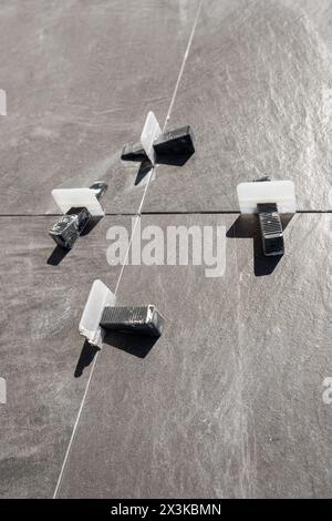 Installed Ceramic tiles with Plastic tile leveling system clips and ...