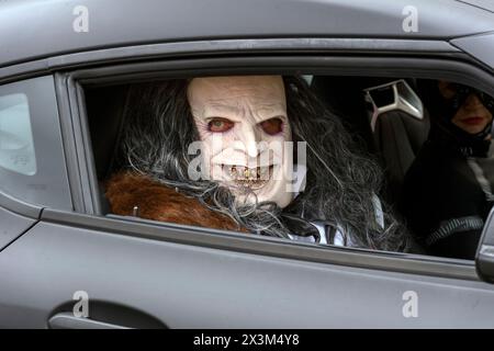 Batman villain, called The Penguin at the Parade of Wonders, signals ...