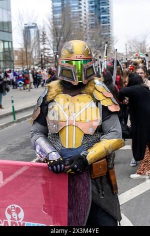 A cosplayer, donning the armor of the Mandalorian, marks the start of ...