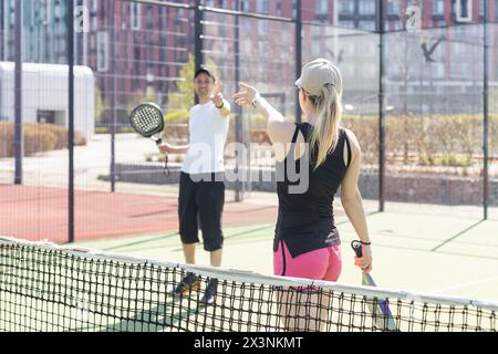 A caucasian padel player jump to the ball, good looking for posts and ...