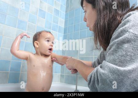 Mother and son in shower Stock Photo - Alamy