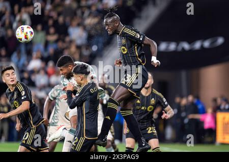 LAFC forward Ken Kamara (23) heads clear a corner kick during a MLS ...