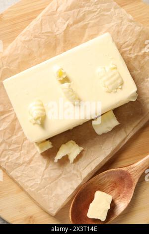 Block butter on parchment paper amd table knife Stock Photo - Alamy