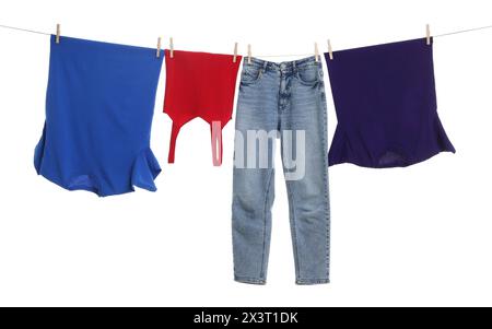 Different clothes drying on laundry line against white background Stock ...