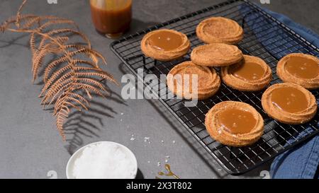Caramel cookies flowing out of the oven, in the kitchen after baking ...