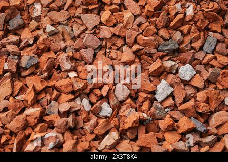 Small pieces of red clay brick or broken bricks background. These chips ...