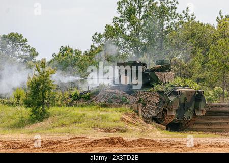 An Abrams tank fires on a simulated enemy position on Red Cloud Range ...