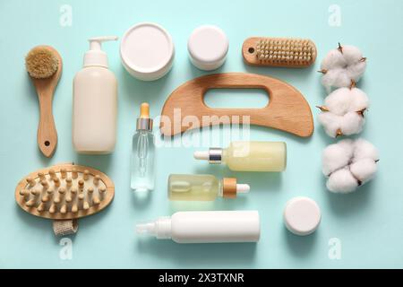 Beautiful spa composition with guasha body scraper on beige background ...